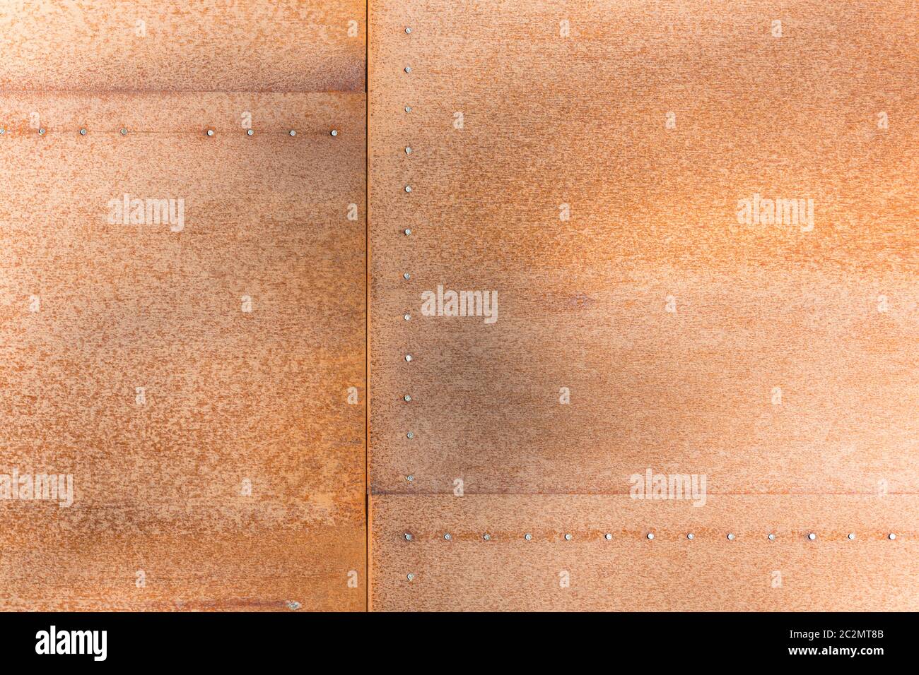Rusty metal with small rivets as background Stock Photo - Alamy