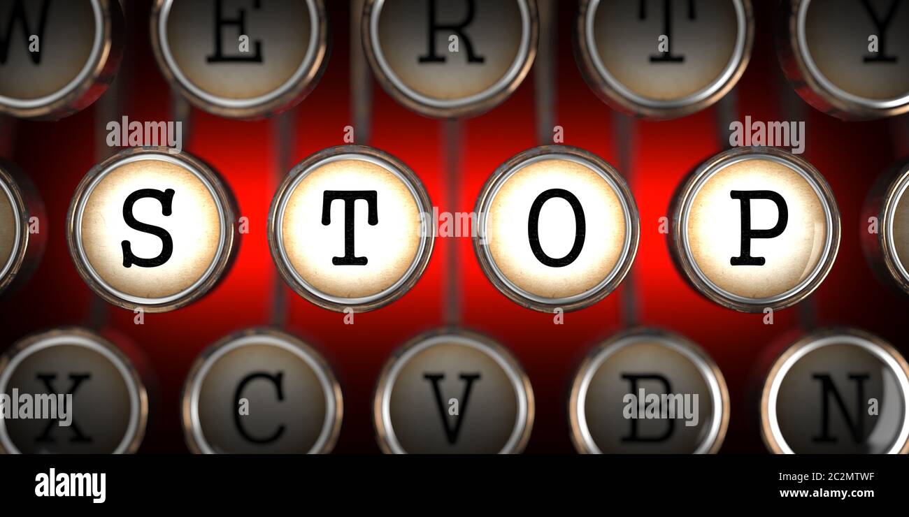 Stop on Old Typewriter's Keys on Red Background Stock Photo - Alamy