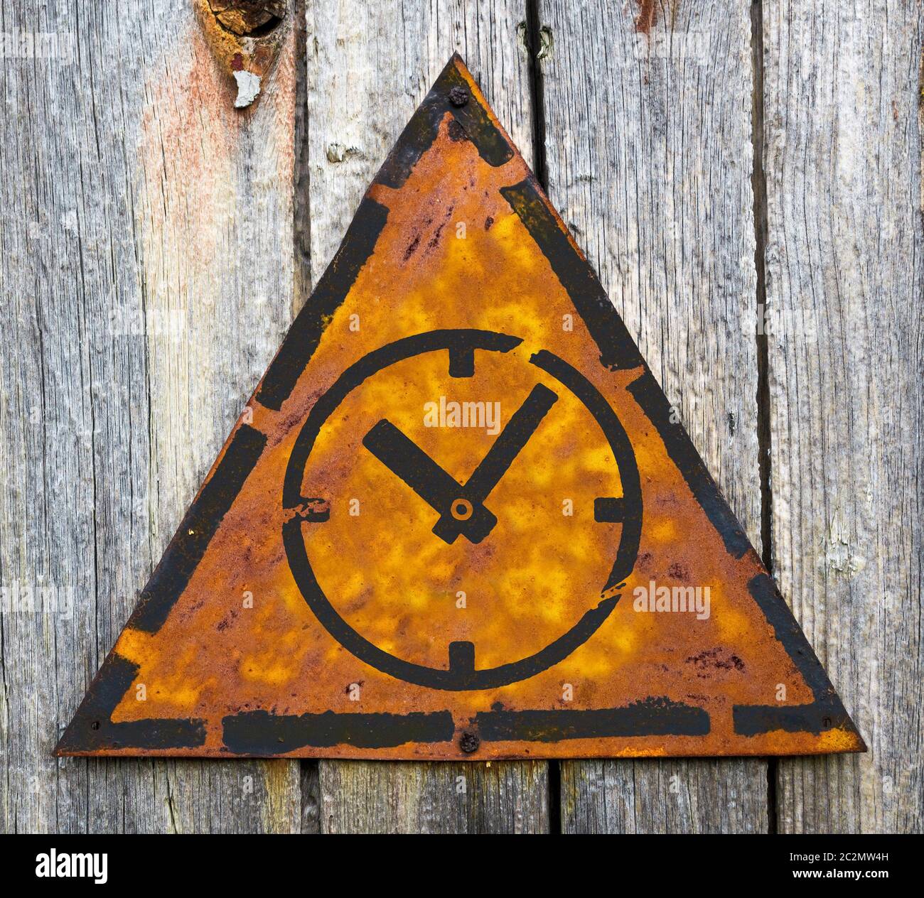 Icon of Clock Face on Weathered Triangular Yellow Warning Sign. Grange ...