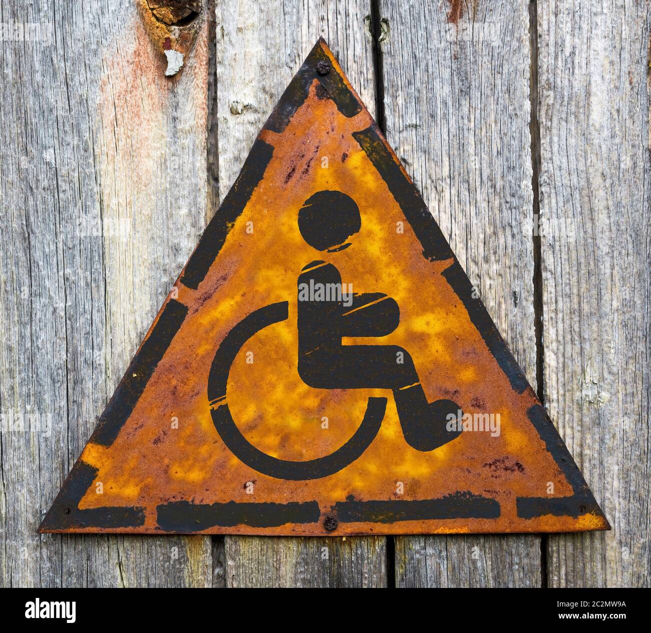 Disabled Icon on Weathered Triangular Yellow Warning Sign. Grange ...