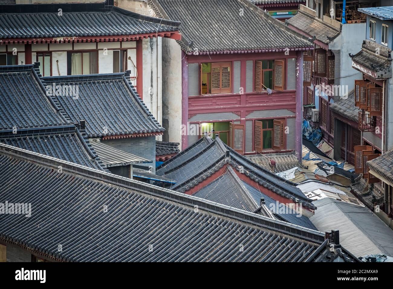 Traditional rooftops of old buildings in the centre of Xian city ...