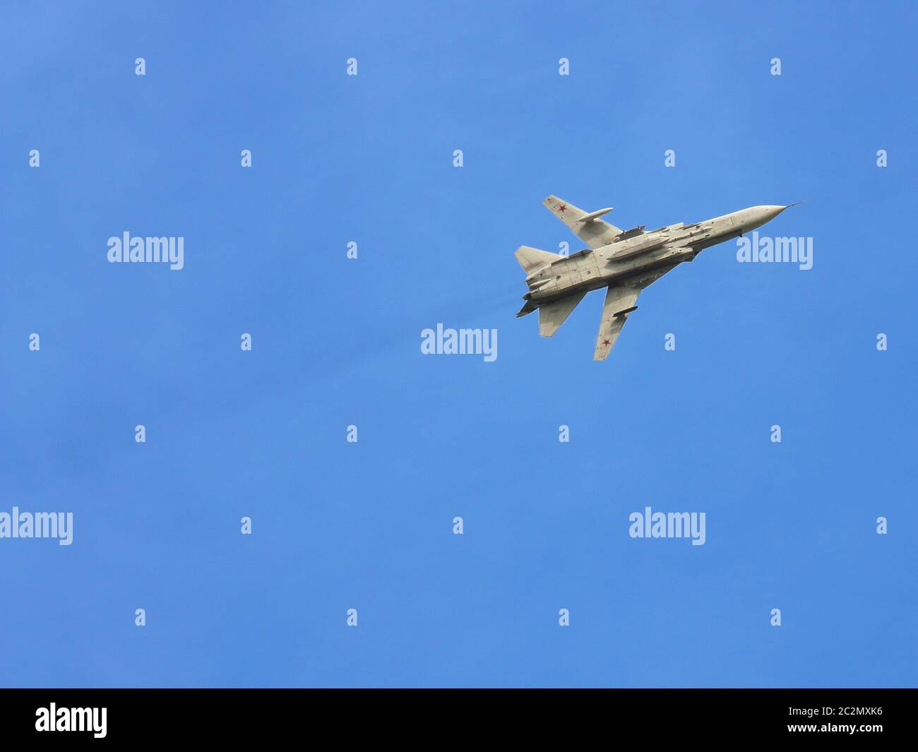 Airplane in the sky with jet trail Stock Photo - Alamy