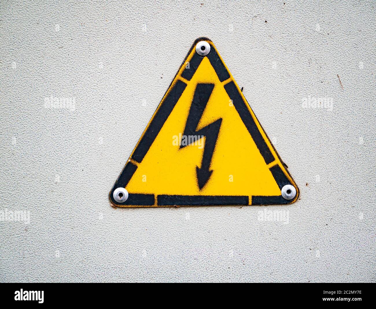 Triangular sign of high voltage. Danger Stock Photo - Alamy