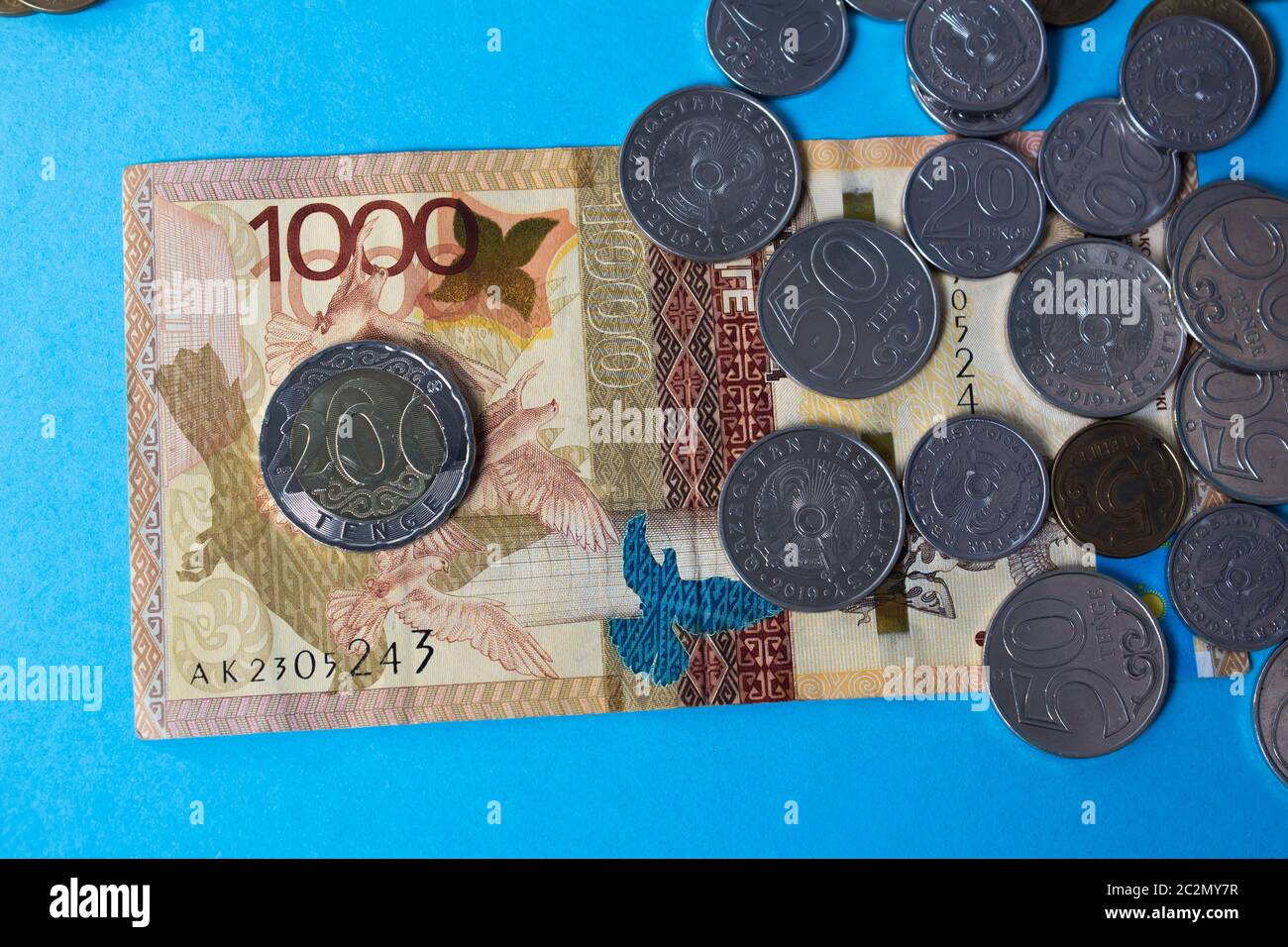 New coin 200 tenge in Kazakhstan. Paper banknotes tenge KZT. Tenge is ...