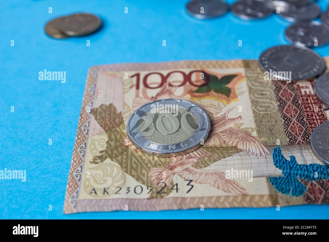 New coin 200 tenge in Kazakhstan. Paper banknotes tenge KZT. Tenge is ...