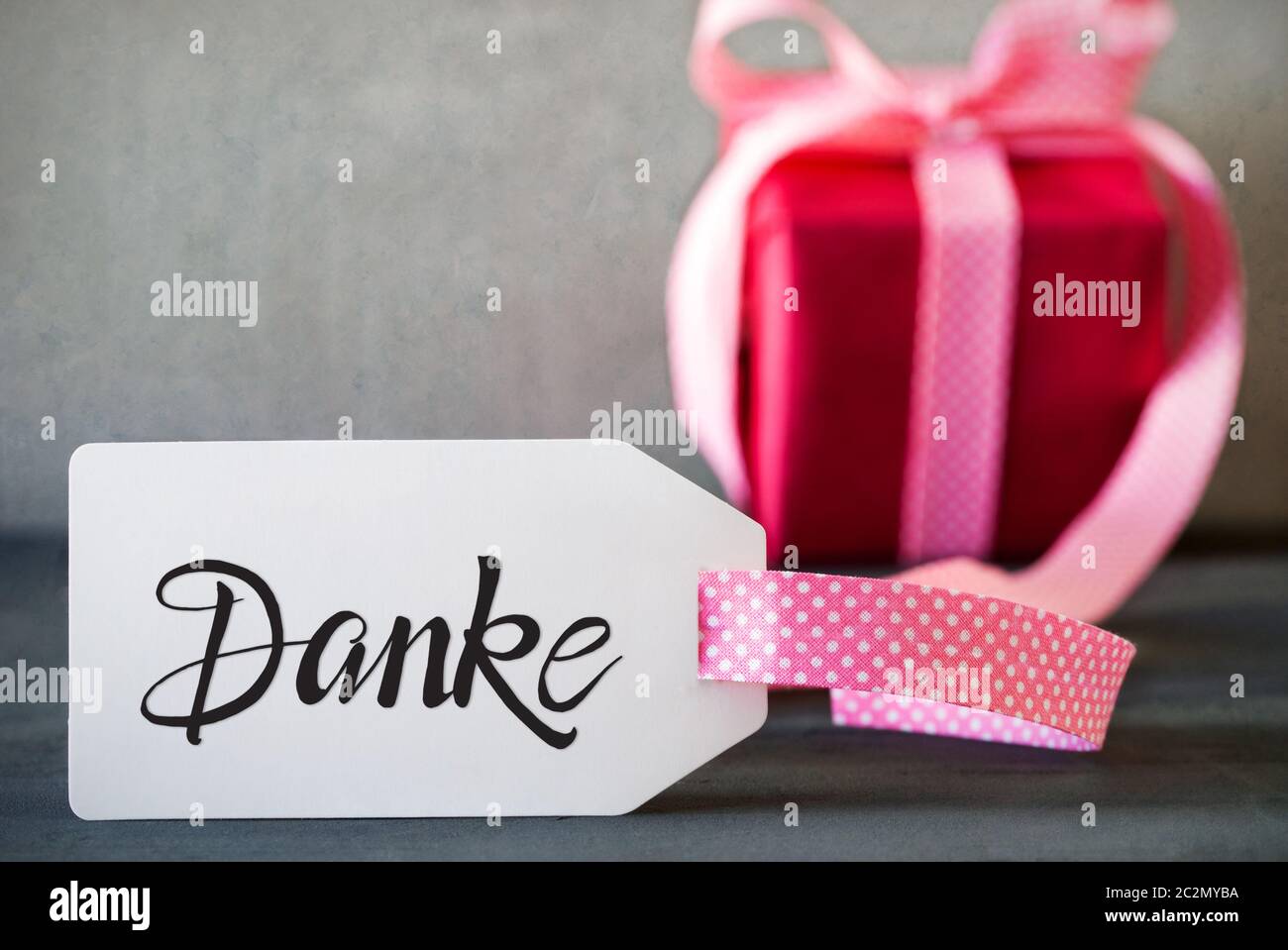German Calligraphy Danke Means Thank You. Pink Present With Bow And ...