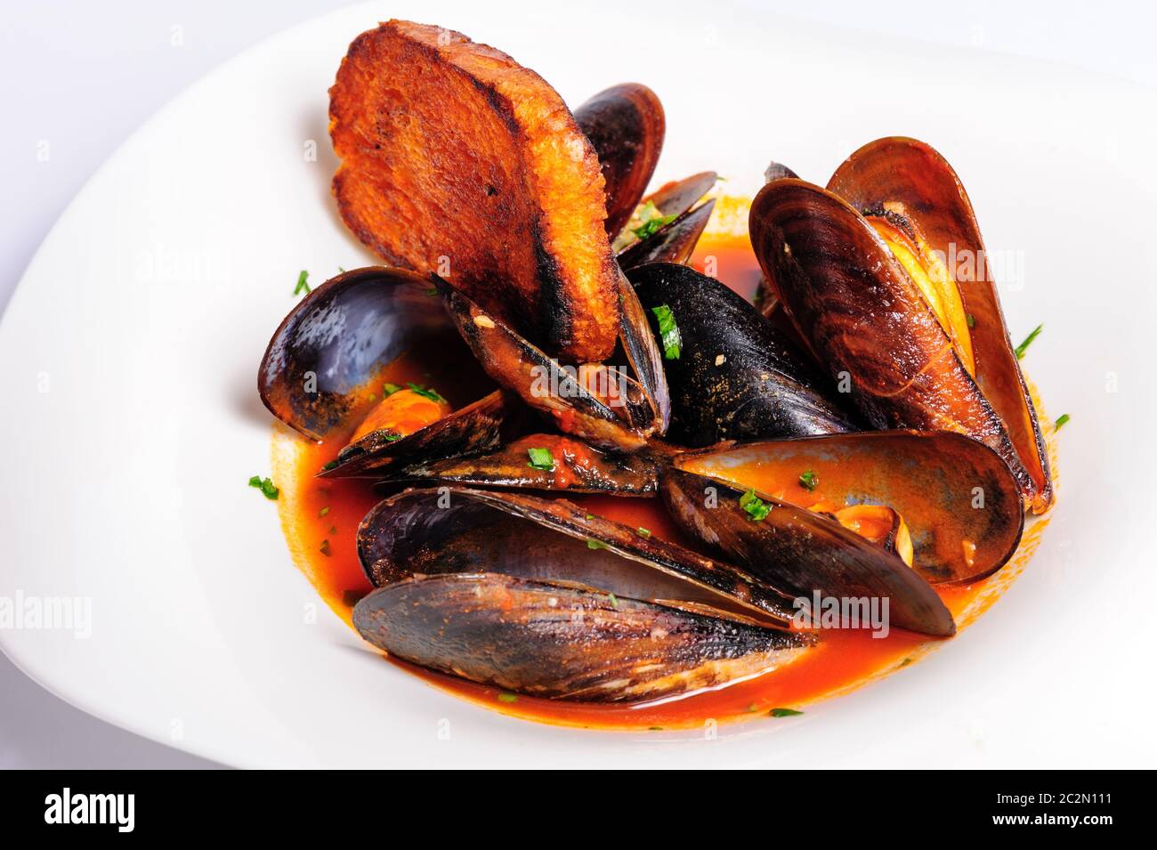 Mussels in italian rustic style Stock Photo - Alamy