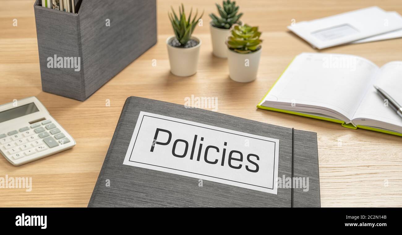 A folder on a desk with the label Policies Stock Photo - Alamy