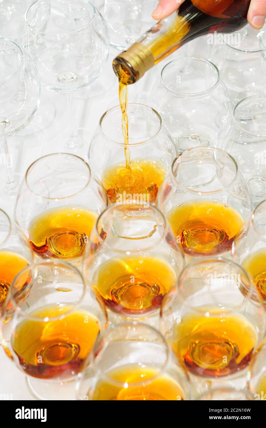 pouring the brandy or cognac Stock Photo - Alamy