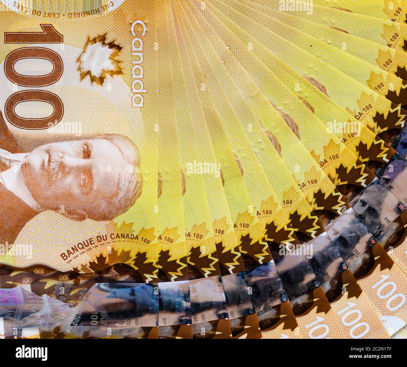 Canadian banknotes of hundred dollar bills background for business and ...