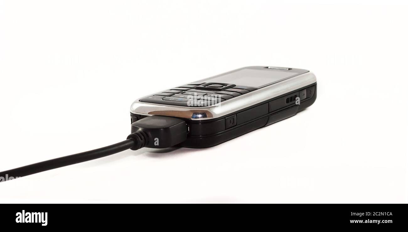 Mobile phone with cable Stock Photo - Alamy