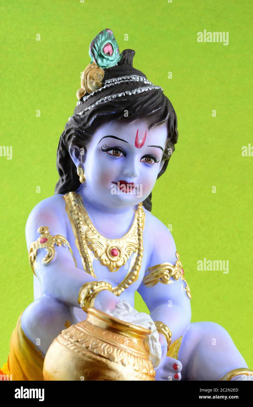 Hindu God Krishna on green background Stock Photo - Alamy