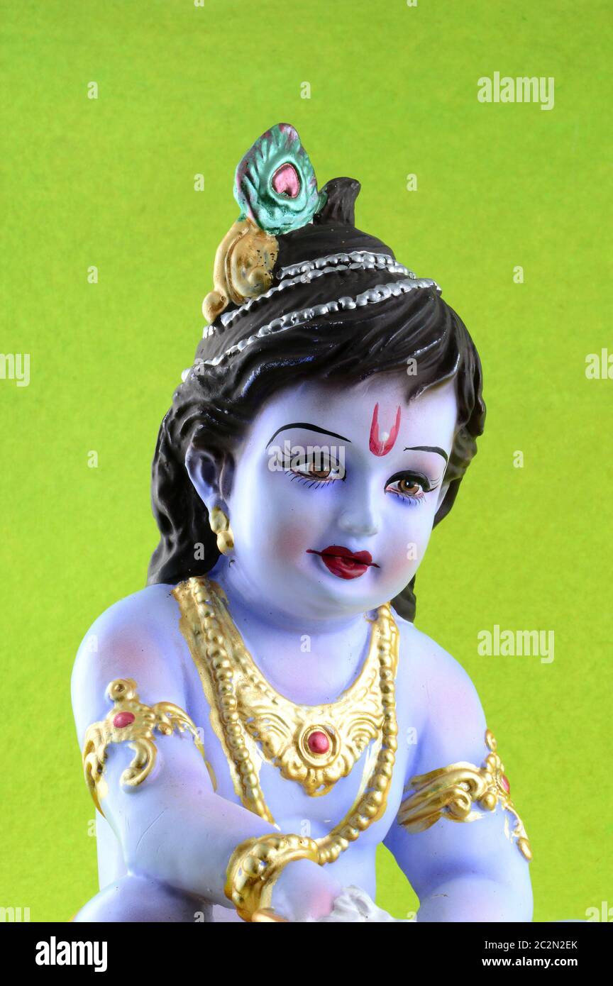 Hindu God Krishna on green background Stock Photo - Alamy