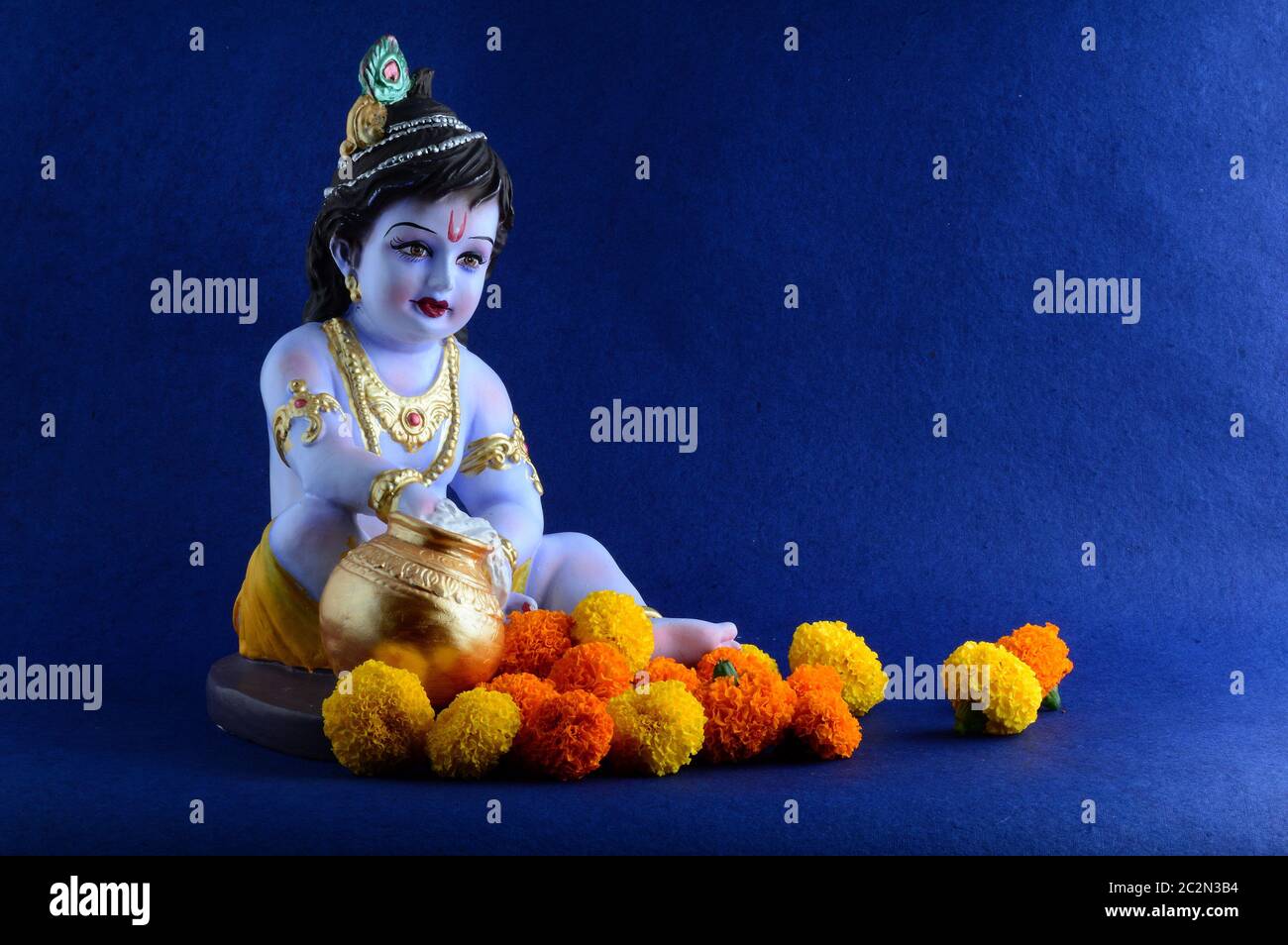 Hindu God Krishna on blue background Stock Photo - Alamy