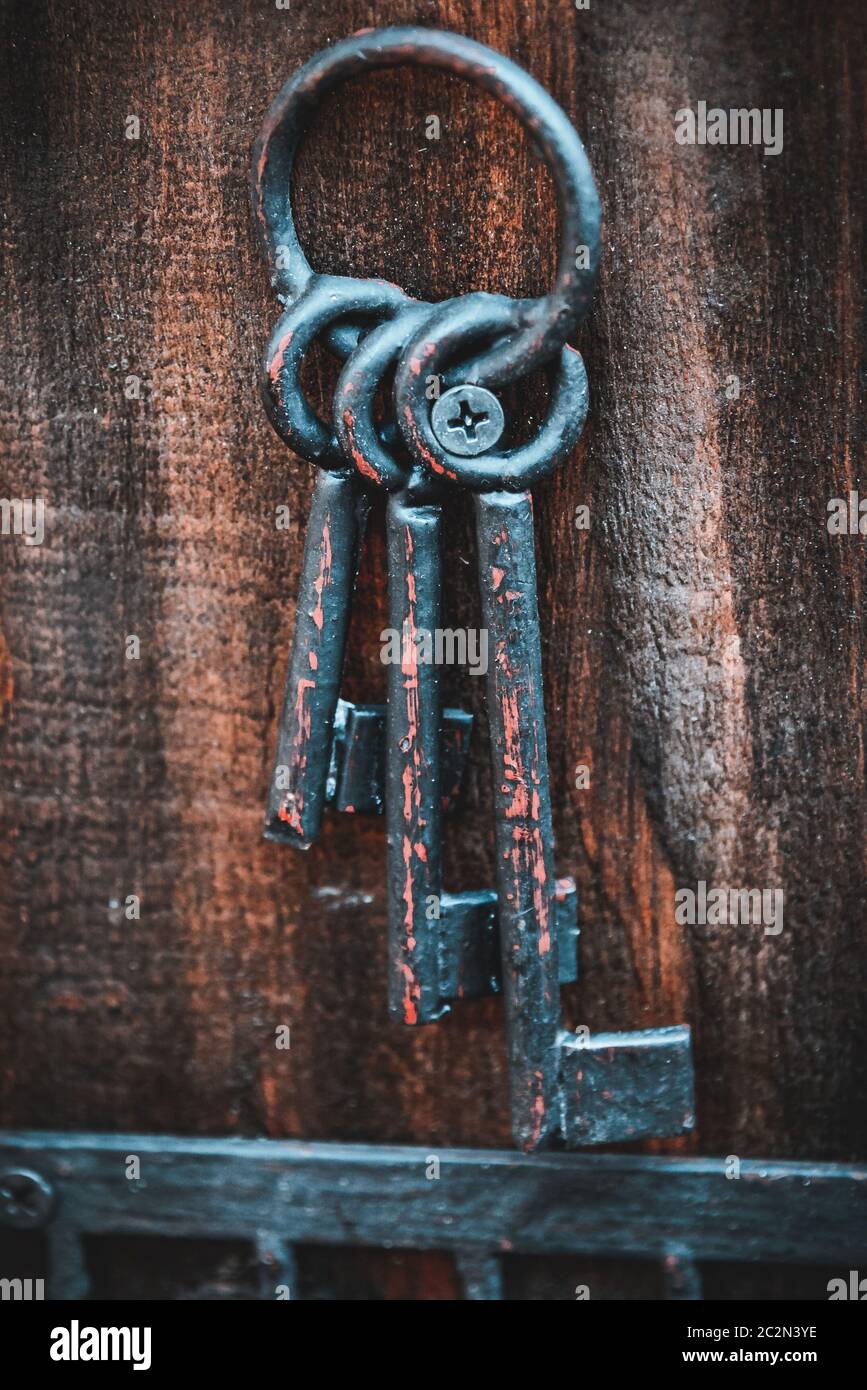 Antique bronze keys wooden background hi-res stock photography and ...
