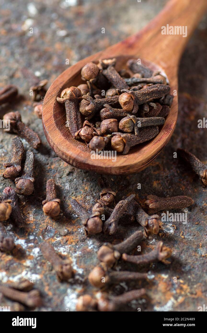 Cloves on a textured background. Spices, Food and cuisine ingredients ...