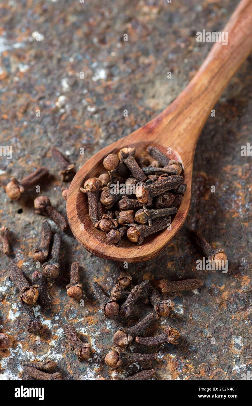 Cloves on a textured background. Spices, Food and cuisine ingredients ...