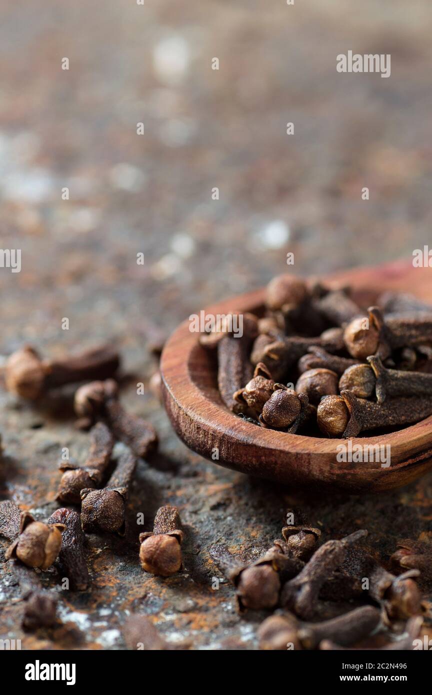 Cloves on a textured background. Spices, Food and cuisine ingredients ...