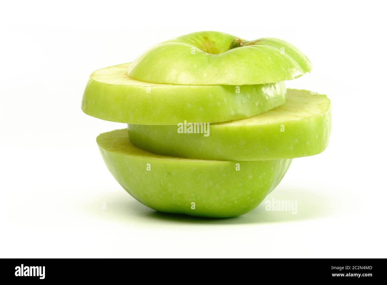 Sliced green apple on white background Stock Photo - Alamy