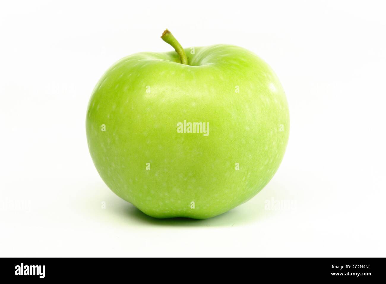 Single green apple on white background Stock Photo - Alamy