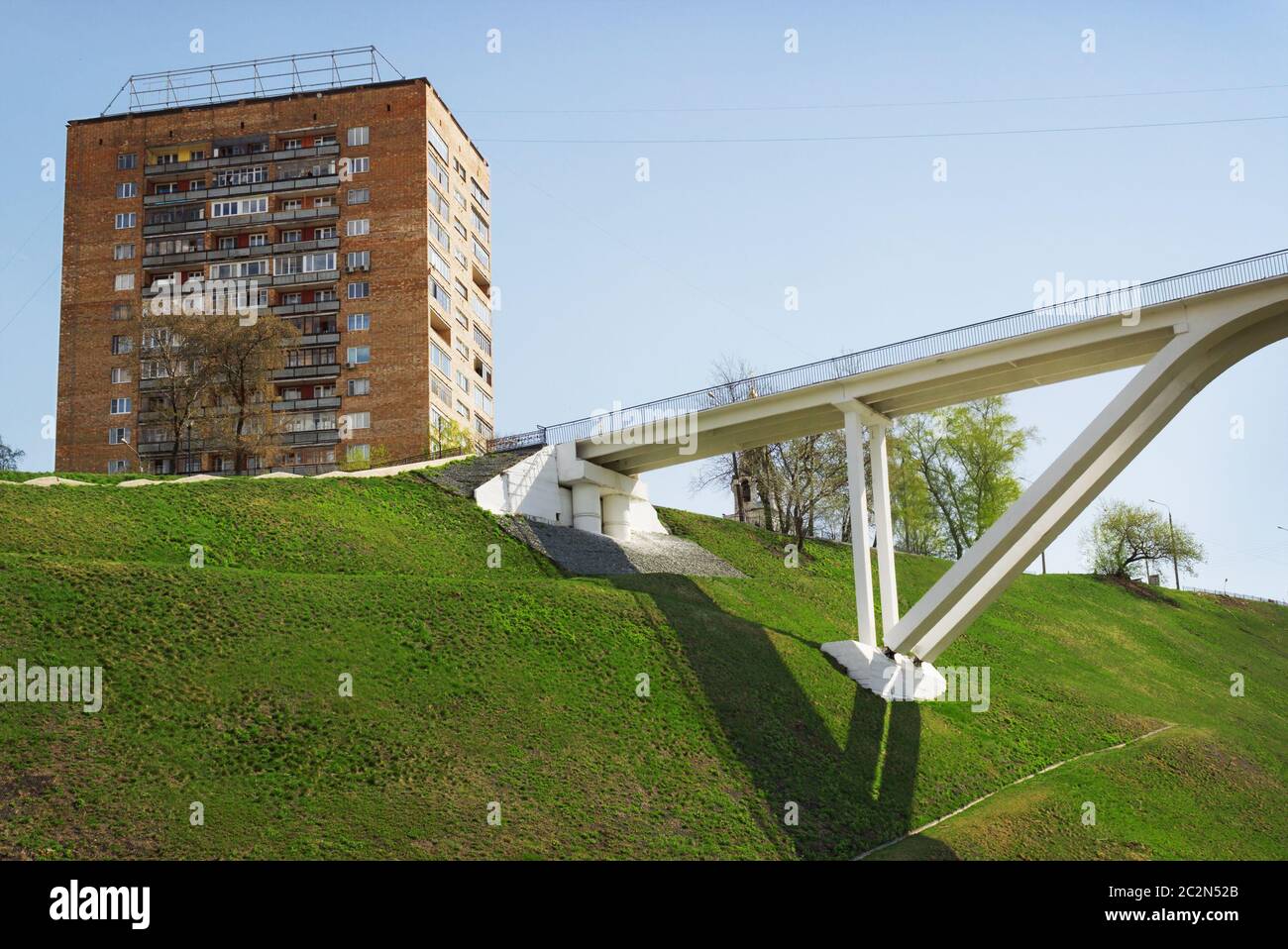Pedestrian bridge of concrete across deep ravine Stock Photo - Alamy