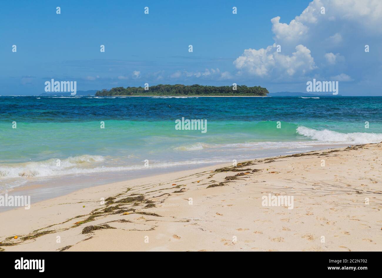 Tropical ocean beach with an island in Panama Stock Photo - Alamy