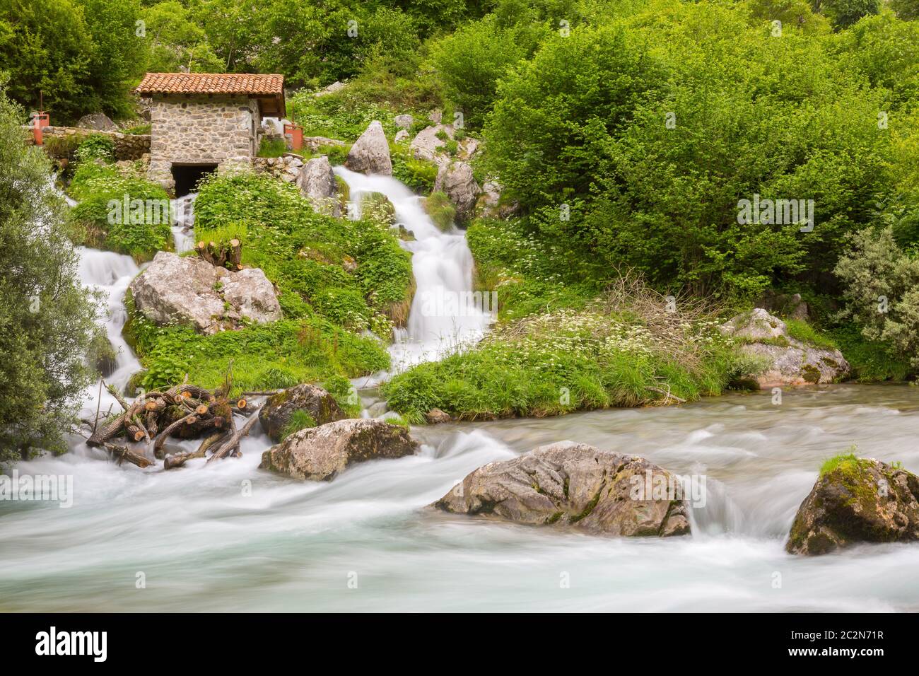 Waterfall in the Cares River located in the Picos de Europa National ...