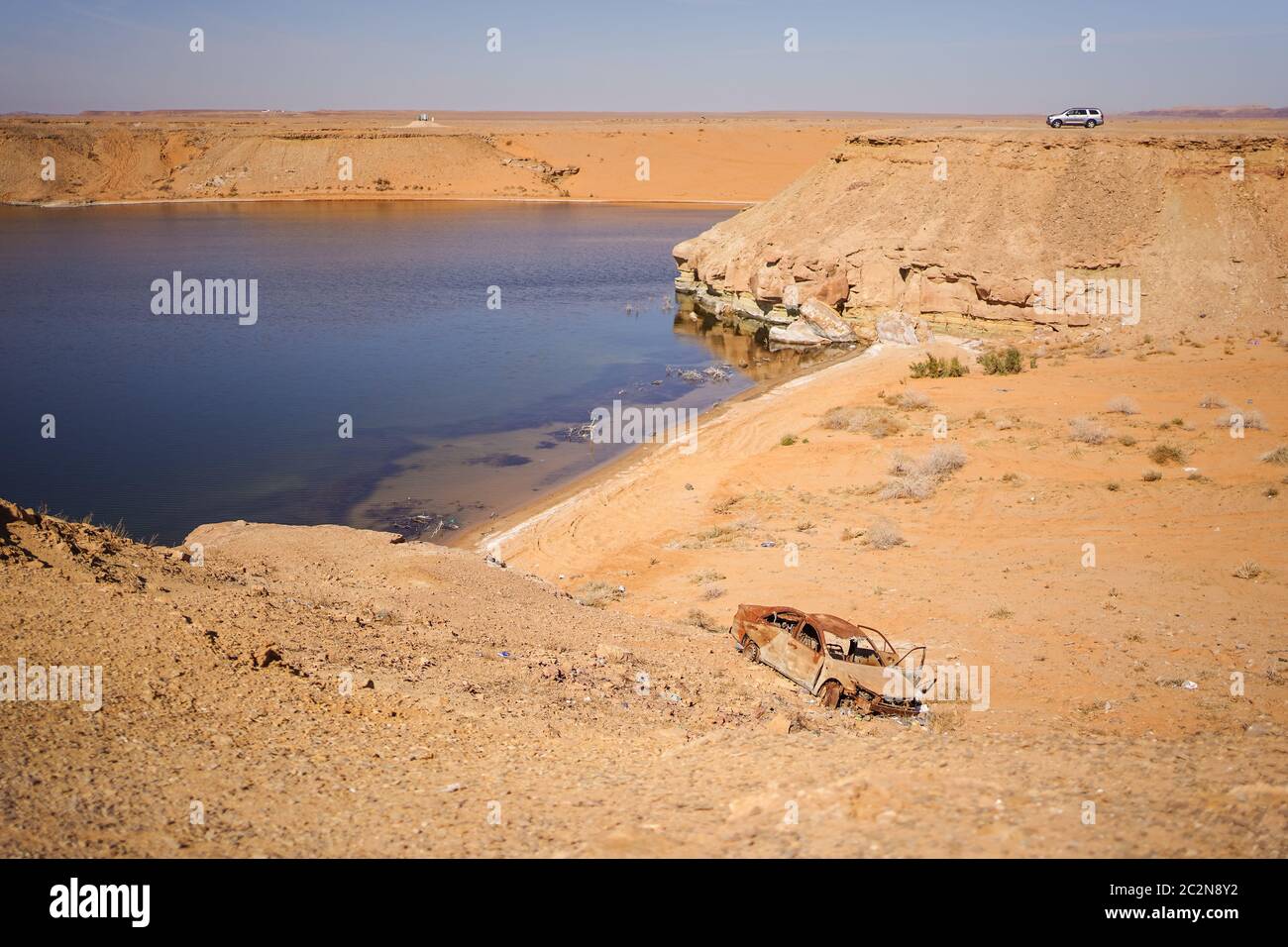 Wrecked car after accident next to Lake Duma Jandal surrounded by sand ...