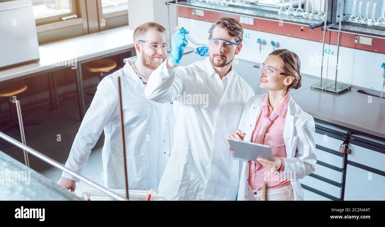 Scientists doing science in the lab Stock Photo - Alamy