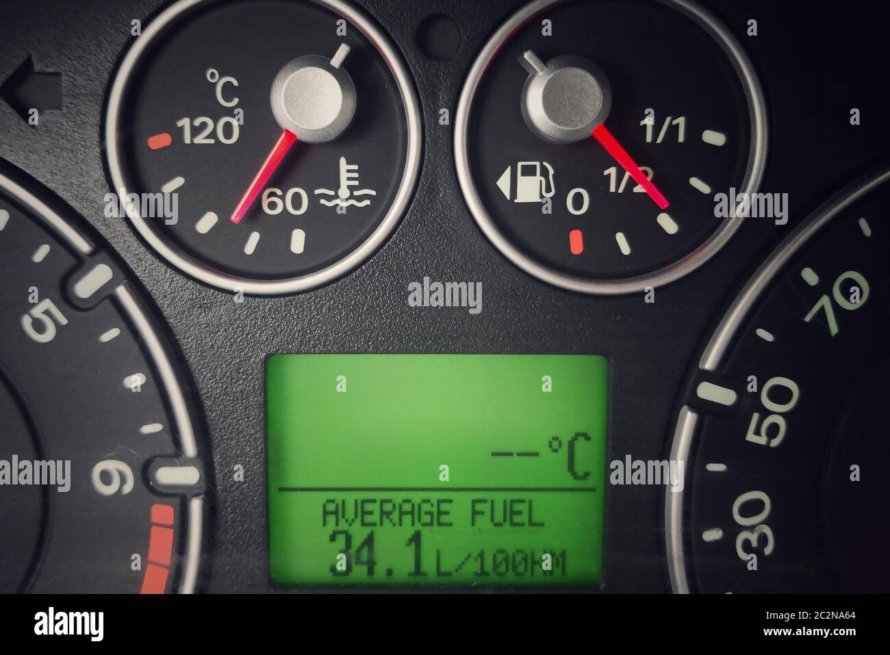 Color close up of a car's digital display, showing a very high fuel ...