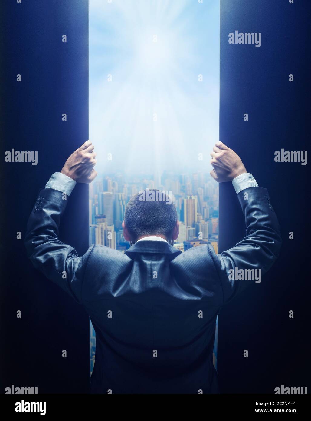 Businessman opening the gate to the city Stock Photo - Alamy