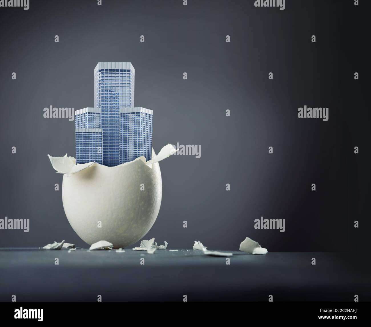 An egg with office buildings inside Stock Photo - Alamy
