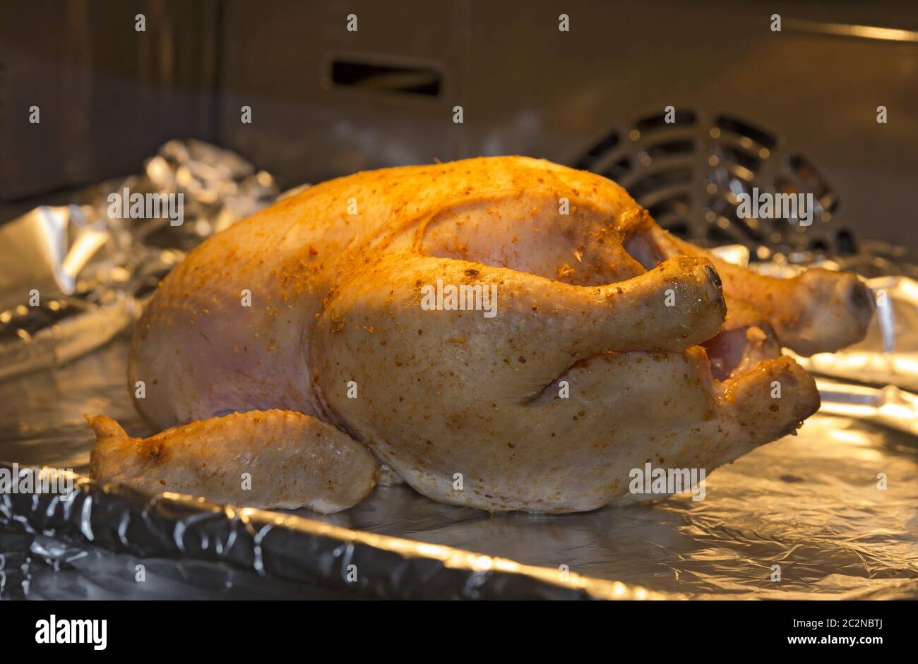 Cooking delicious of roasted chicken in the oven Stock Photo - Alamy