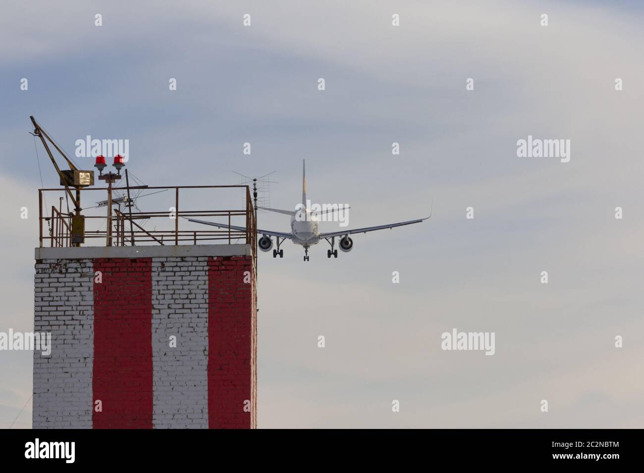 Plane landing over building hi-res stock photography and images - Alamy
