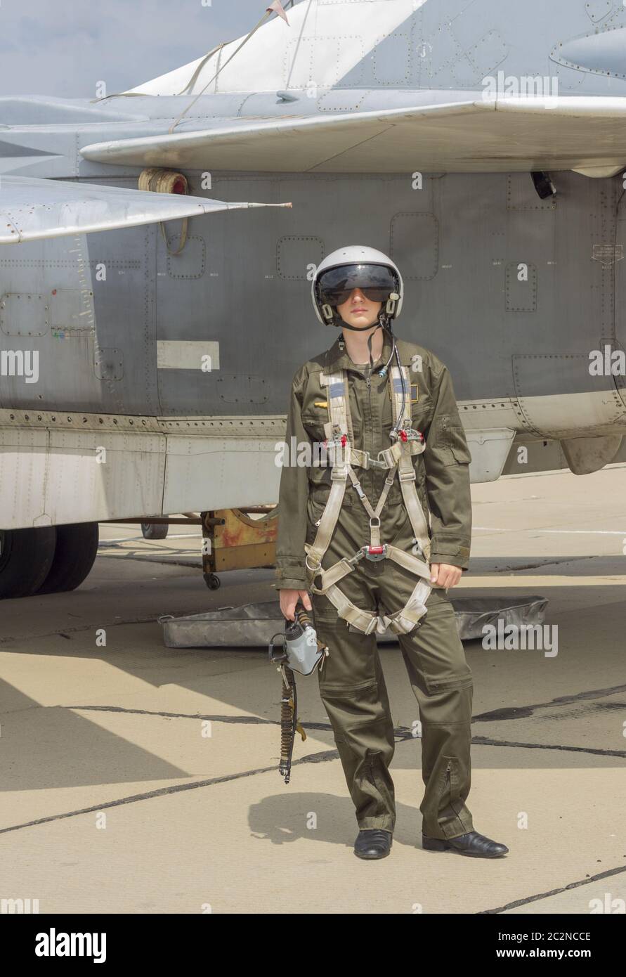 Military pilot in helmet stands near jet plane Stock Photo - Alamy