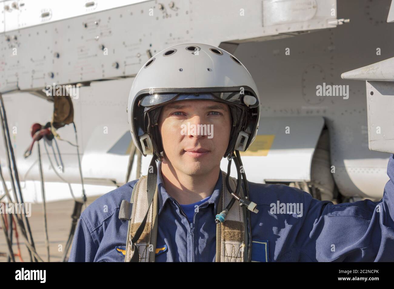 Military pilot in helmet stands near jet plane Stock Photo - Alamy