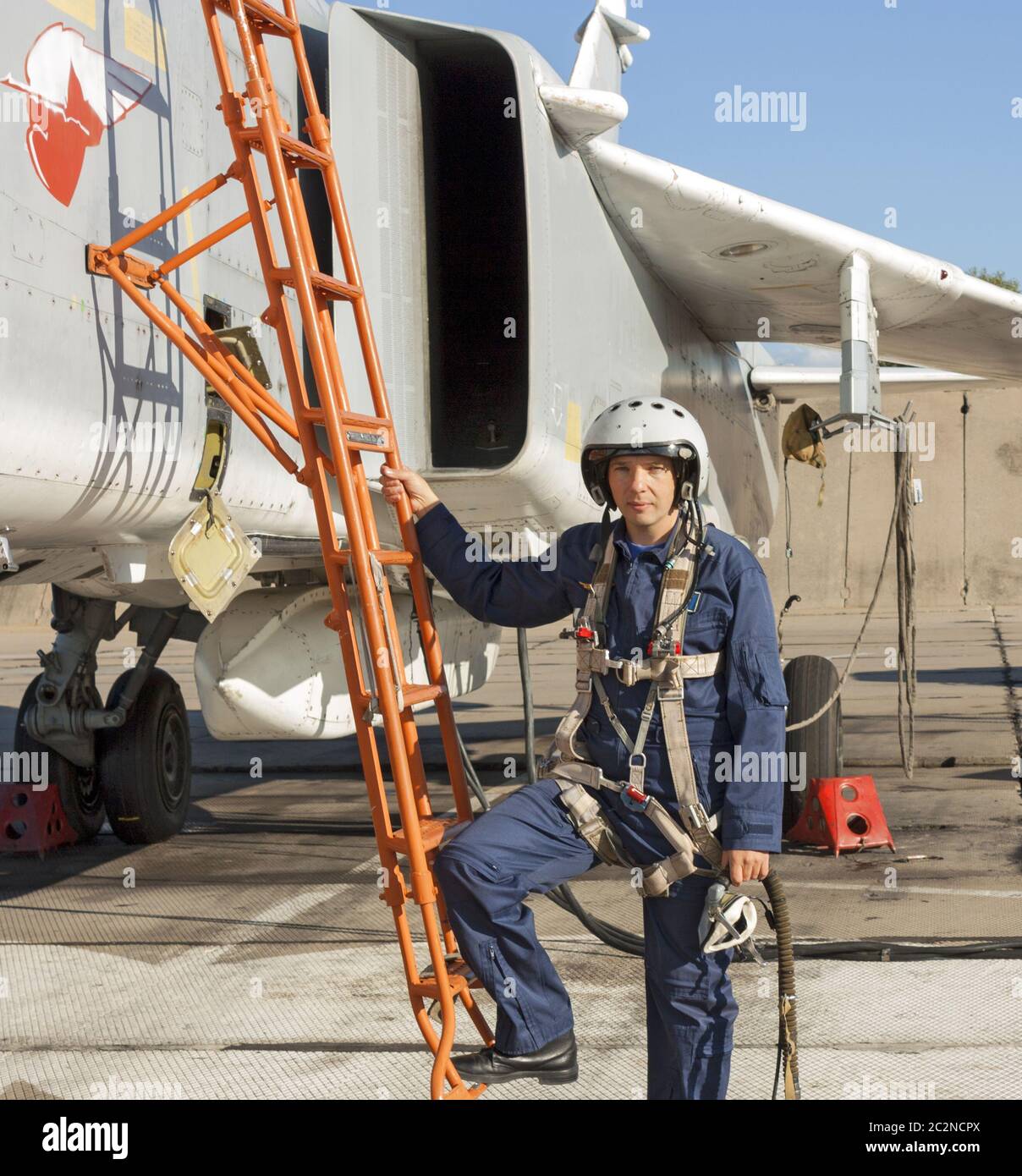 Military pilot in helmet stands near jet plane Stock Photo - Alamy