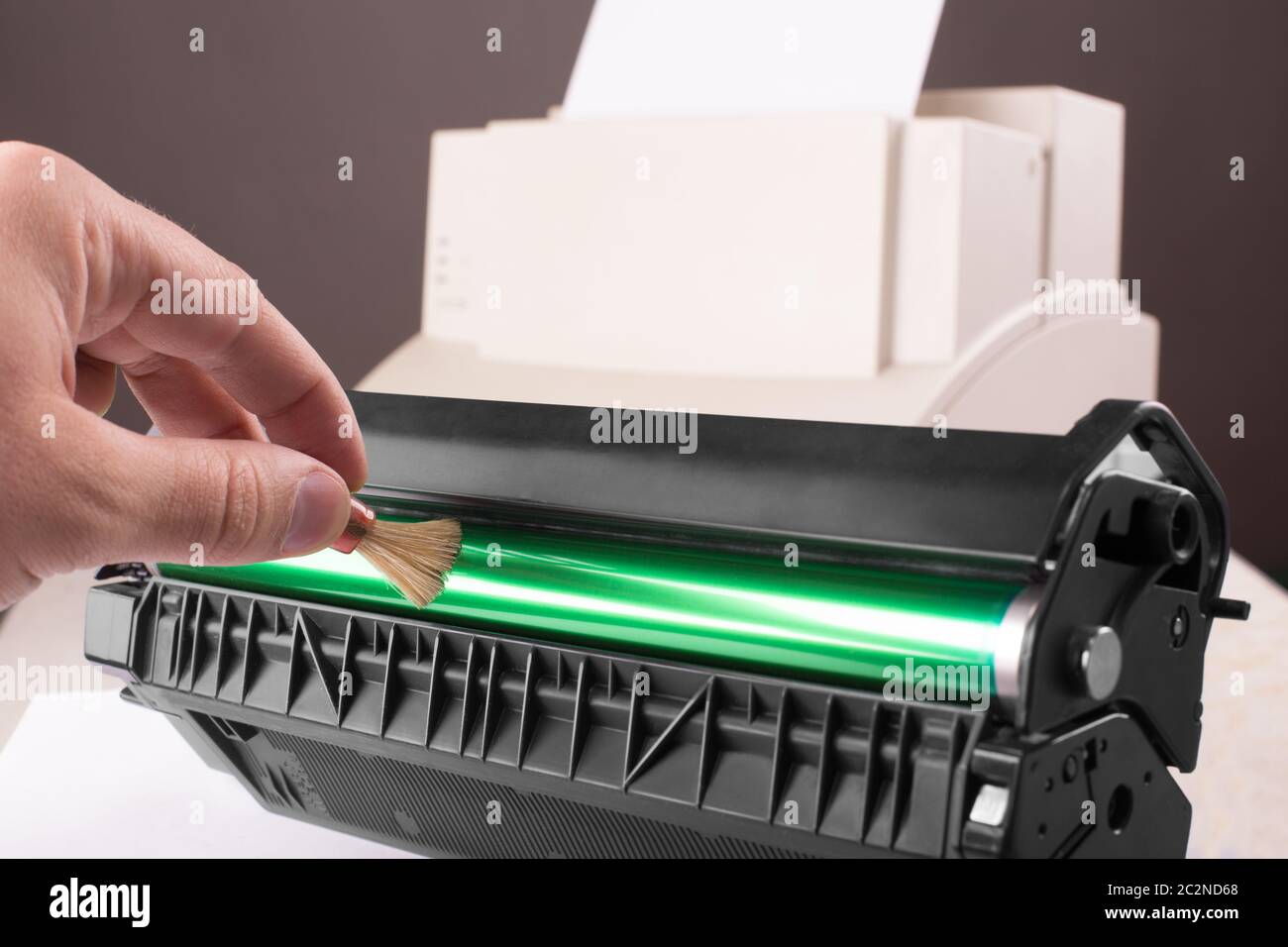 Technician hand cleaning printer toner cartridge Stock Photo - Alamy