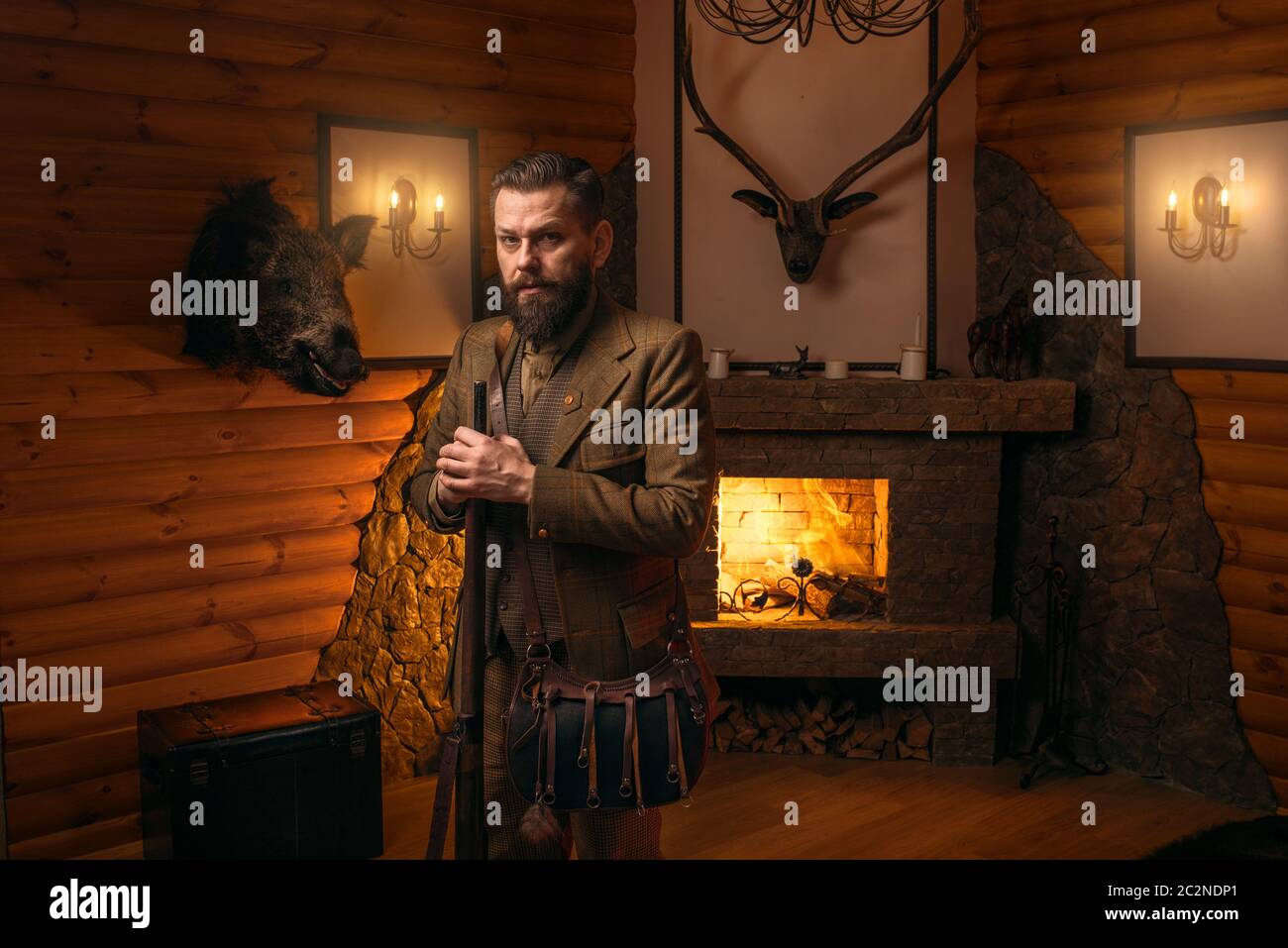 Hunter man with old gun in vintage traditional hunting clothing ...