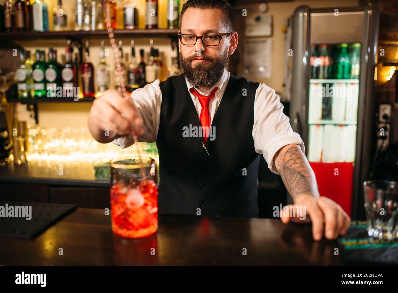 Attractive alcoholic drink preparation show. Professional bartending ...