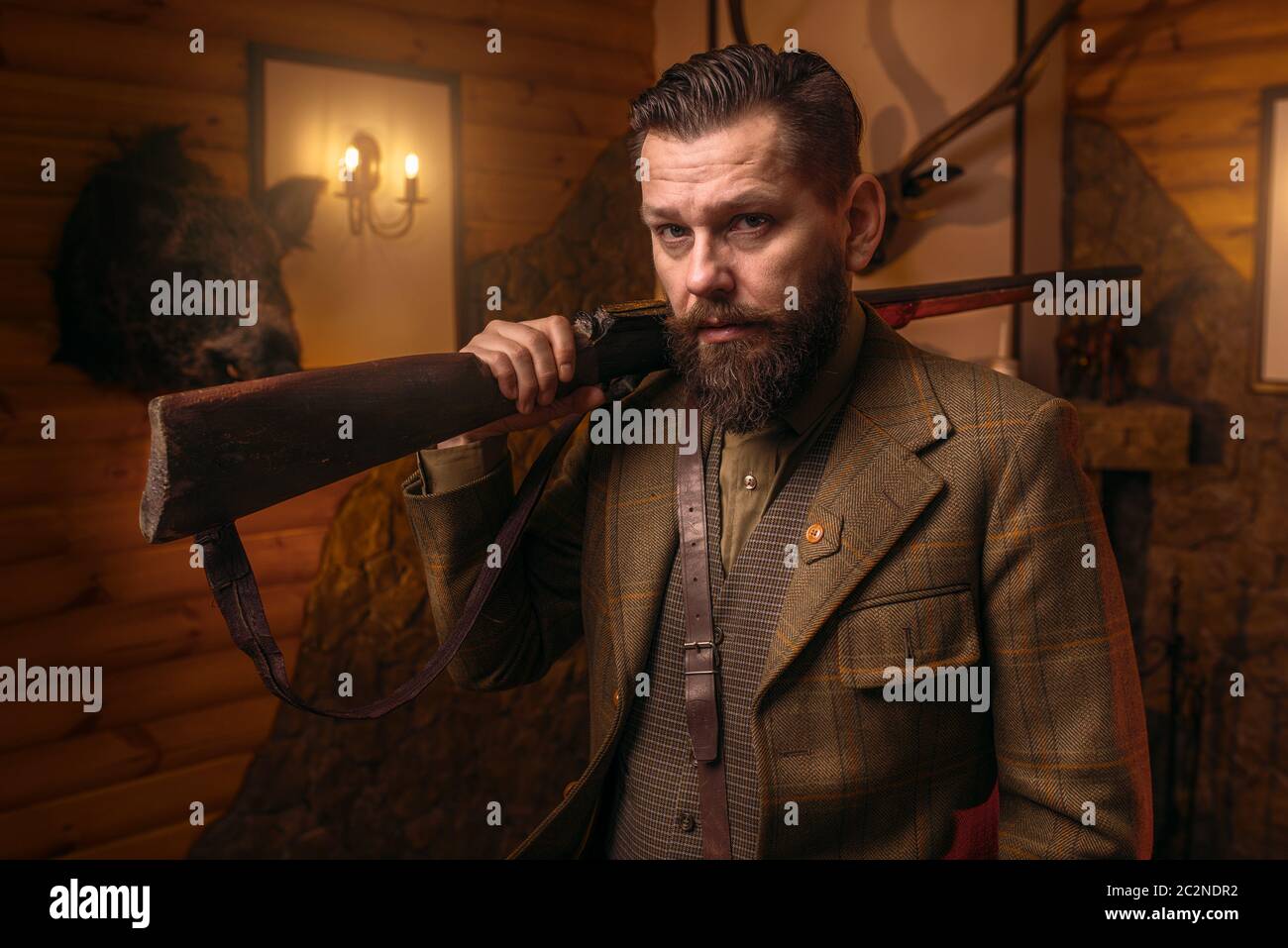 Respectable hunter man in vintage stylish hunting clothing with antique ...