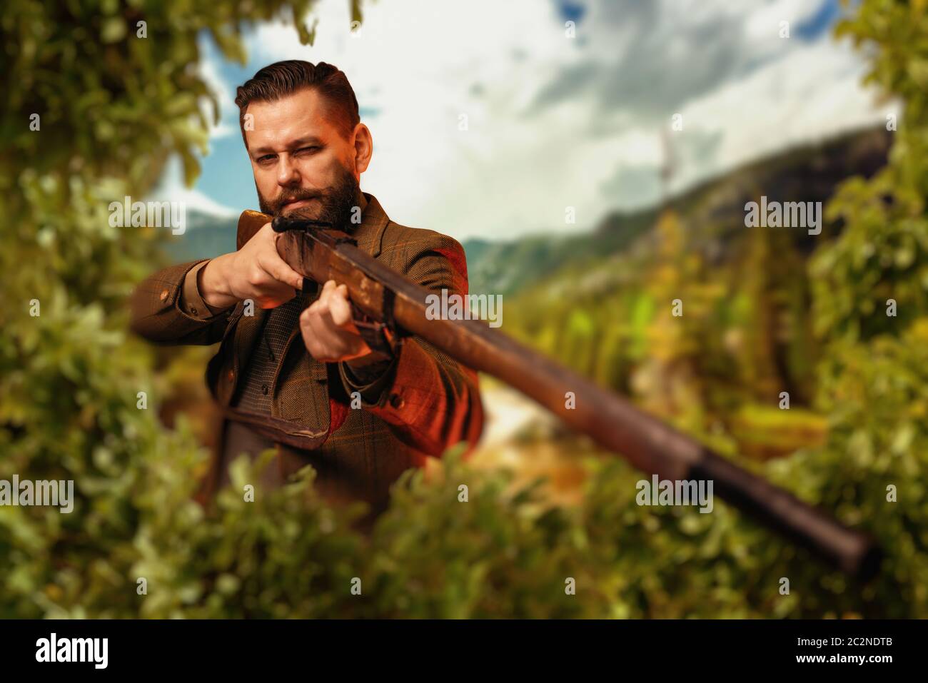 Hunter man in vintage hunting clothing sitting in the bushes and aiming ...