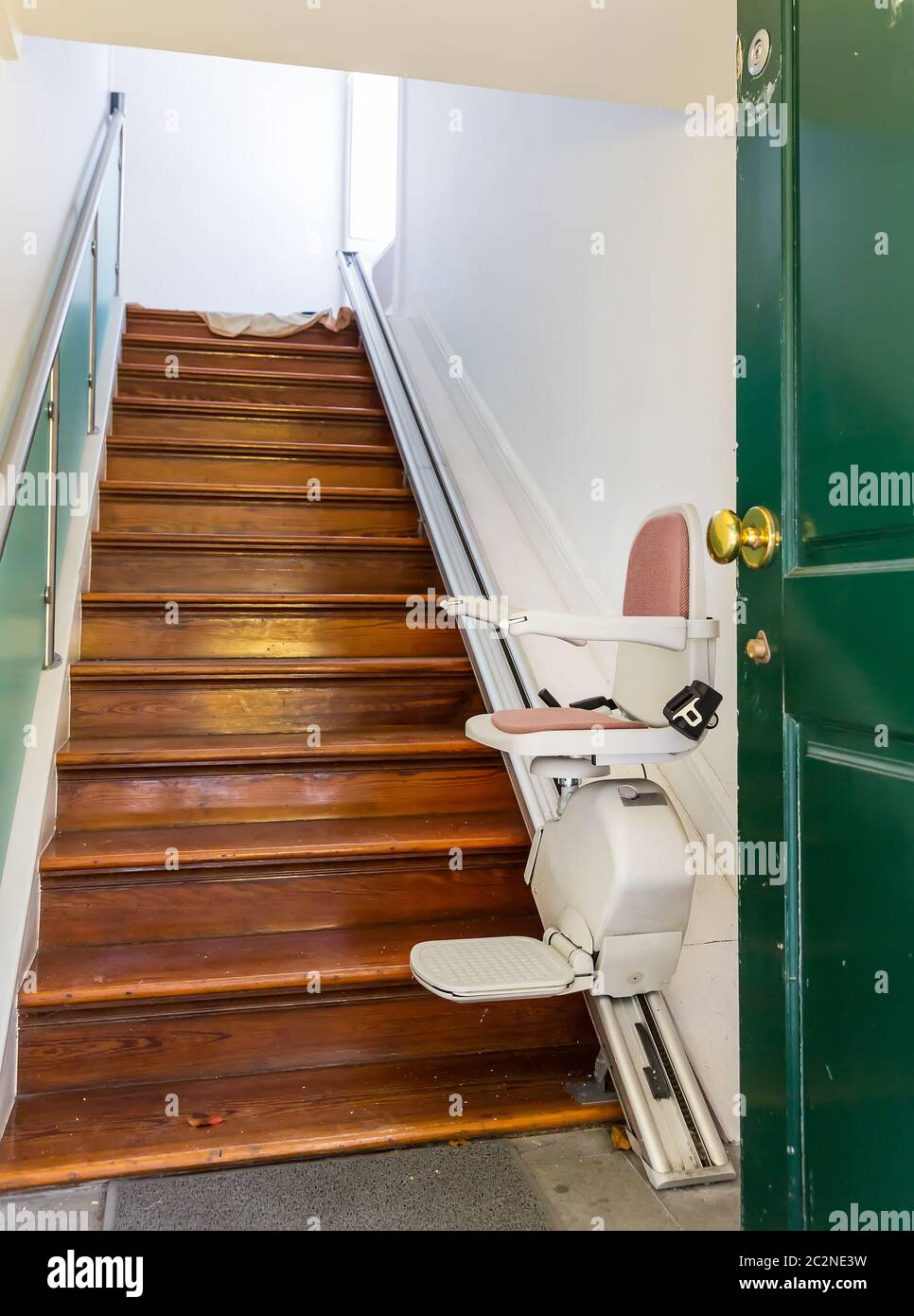 Stairlift for disabled people indoor Stock Photo - Alamy