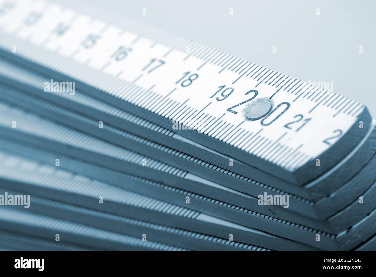 Closeup of wooden rulers. Toned in blue Stock Photo - Alamy