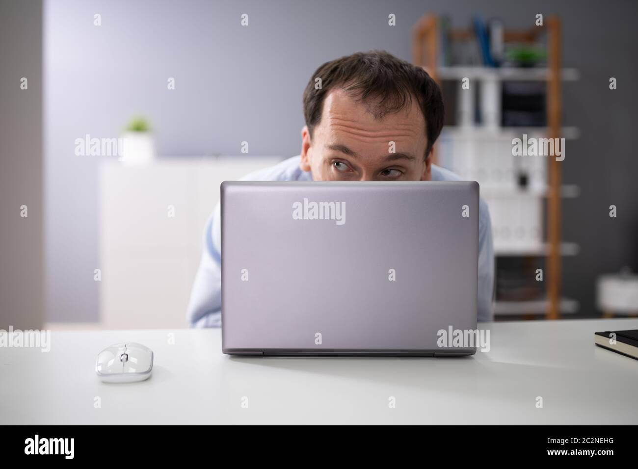 Man Hiding Behind Computer High Resolution Stock Photography and Images ...