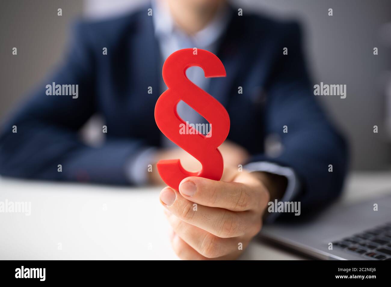 Close-up Of A Businessperson's Hand Holding Paragraph Symbol Stock ...