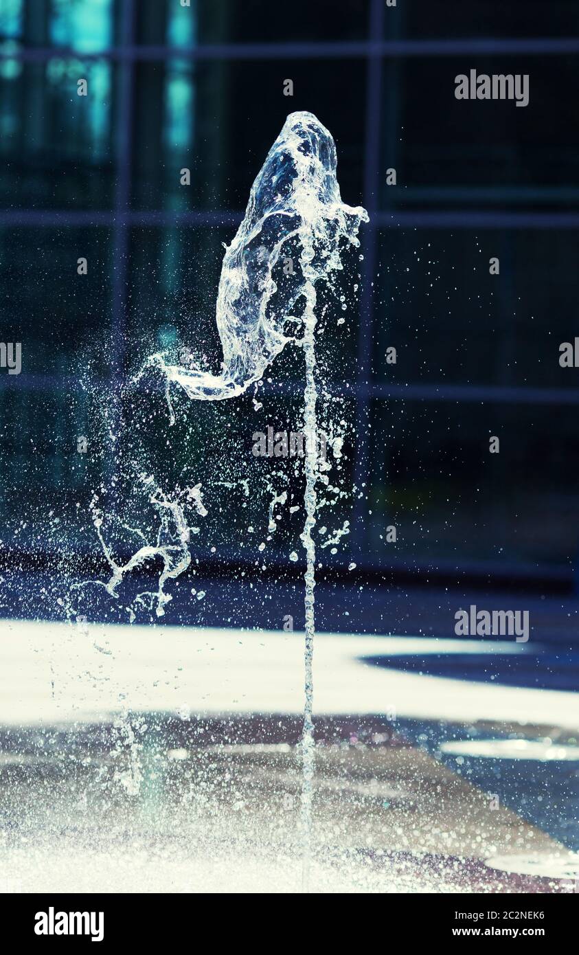 Water stream splashing on ground Stock Photo - Alamy