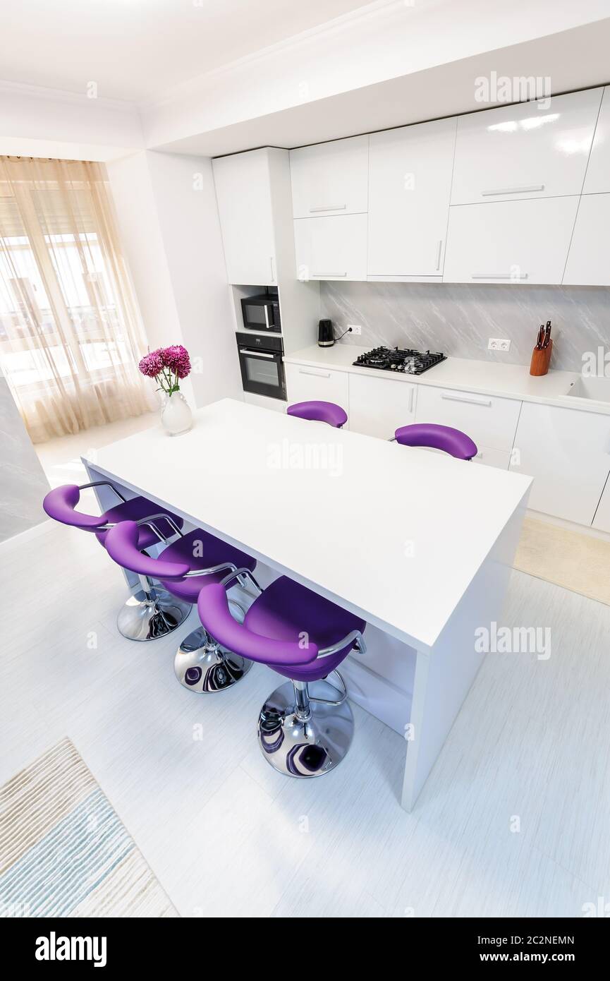 white dining table in modern kitchen Stock Photo - Alamy
