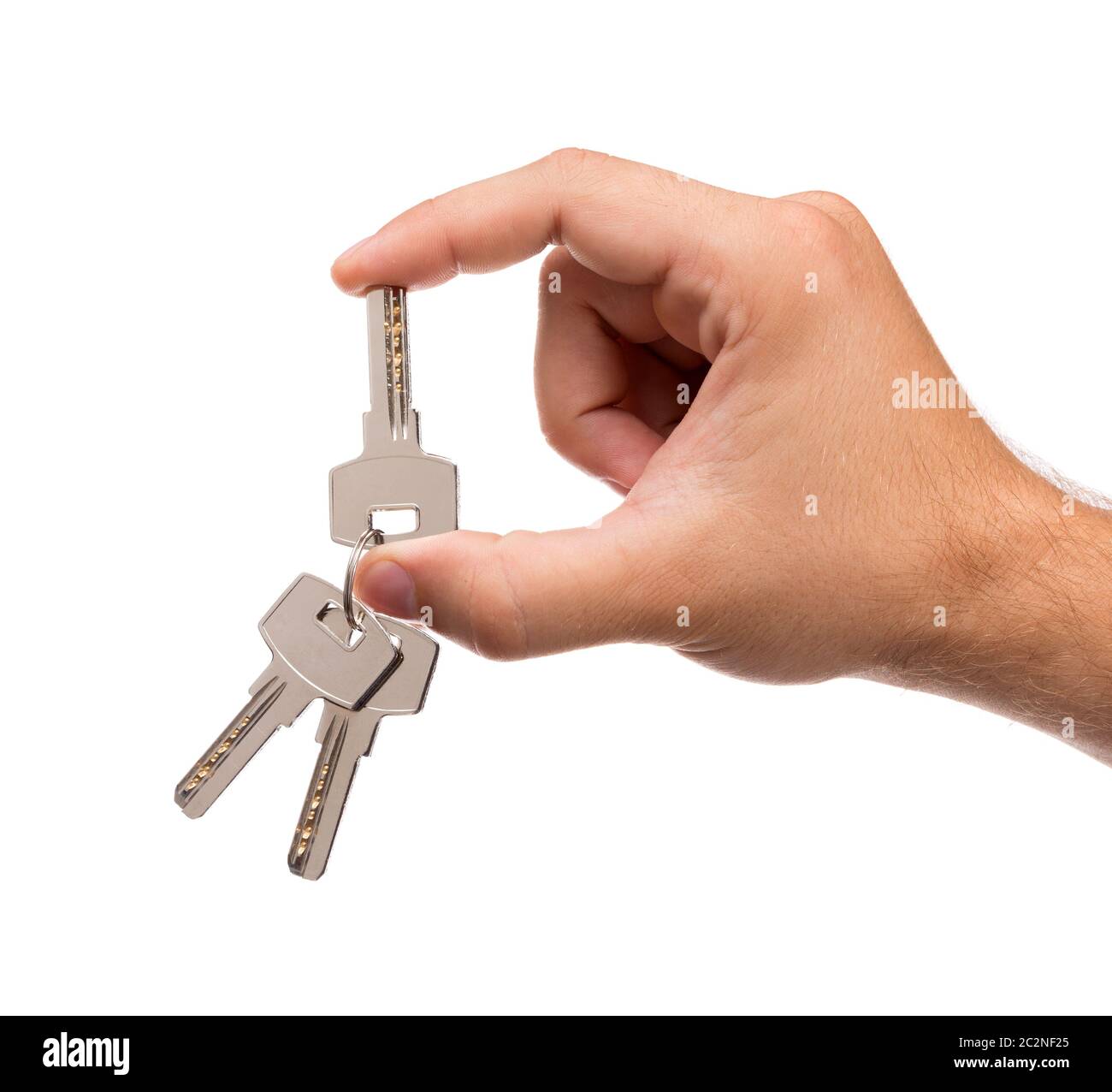 Mens hand holding keys isolated on white Stock Photo - Alamy