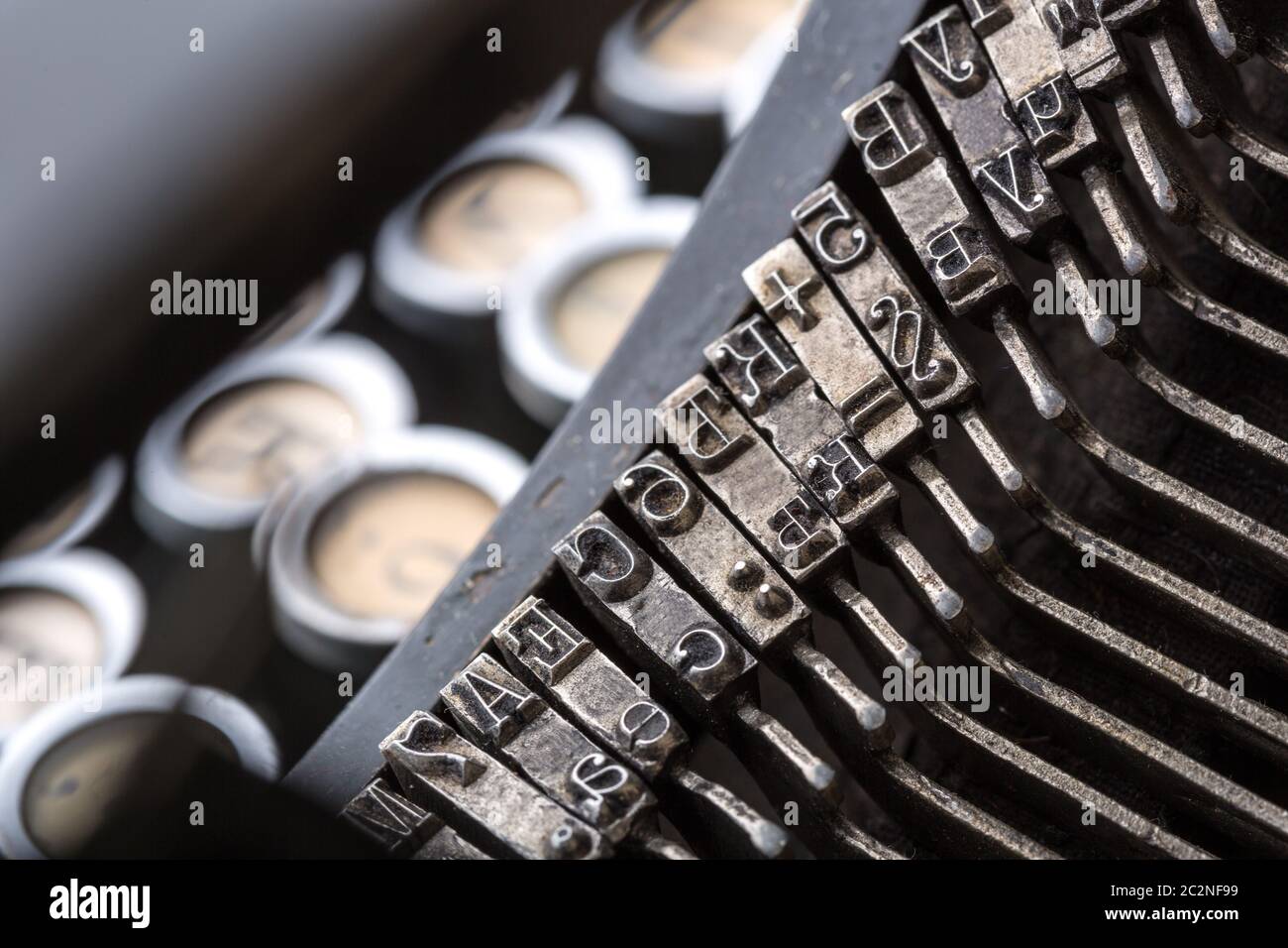 Vintage typewriter mechanism closeup image. Old type writer letters and ...